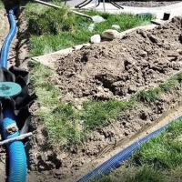How to Bury Downspouts: Complete DIY Guide from the Pros